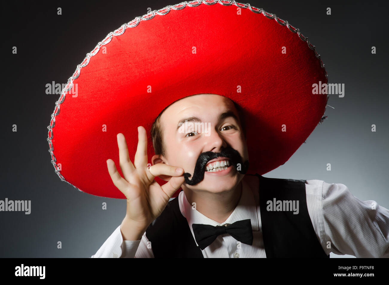 Person wearing sombrero hat in funny concept Stock Photo - Alamy