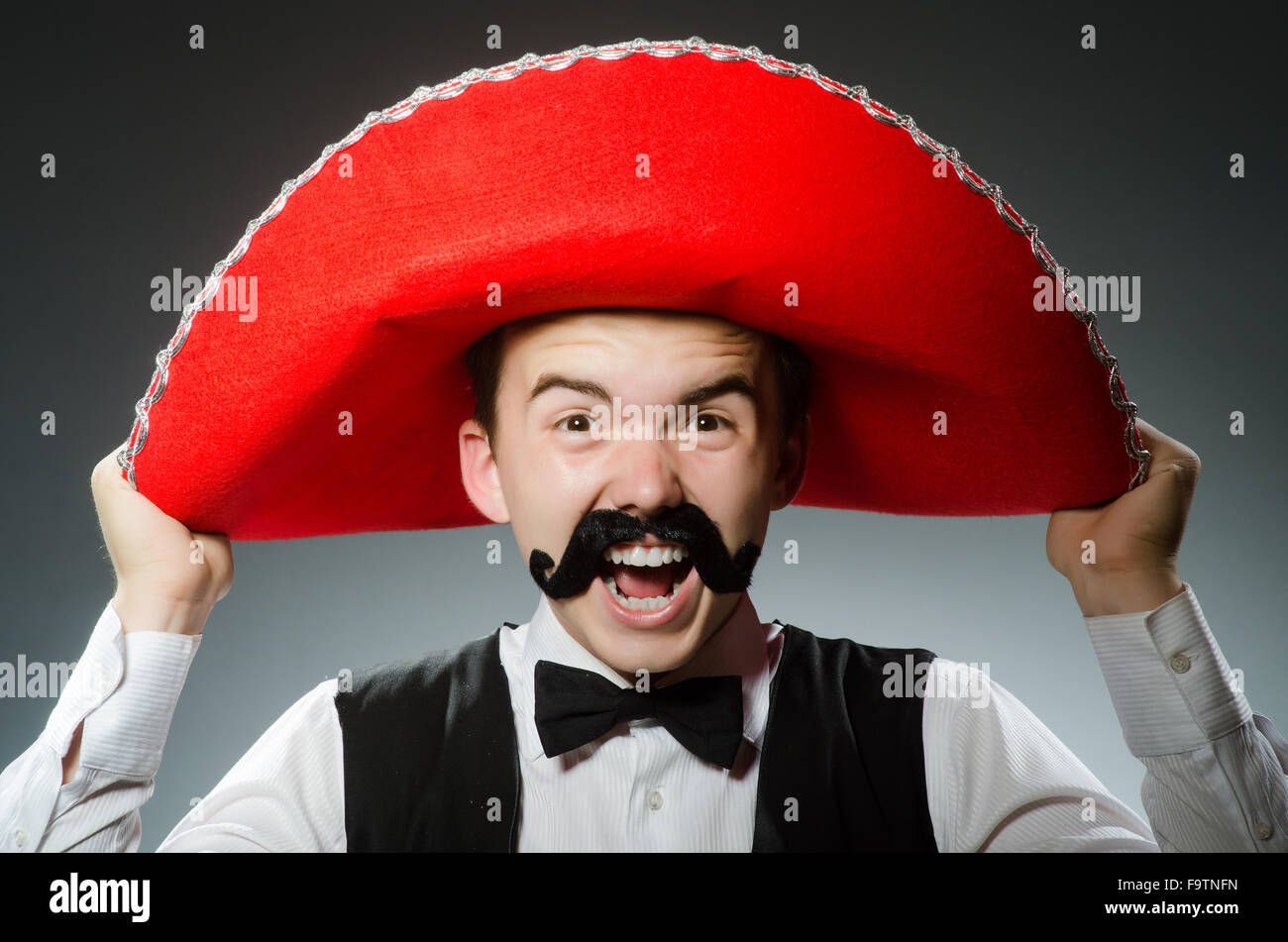 Person wearing sombrero hat in funny concept Stock Photo - Alamy
