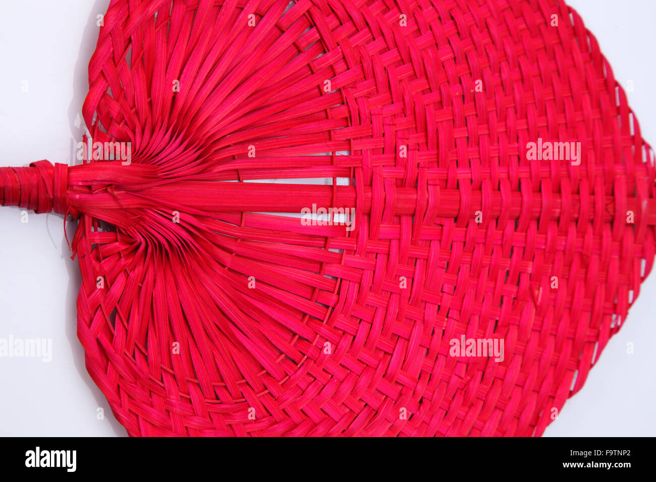 Red color native fan made from palm leaves on white background Stock ...