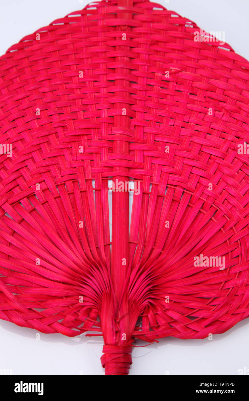 Red color native fan made from palm leaves on white background Stock ...