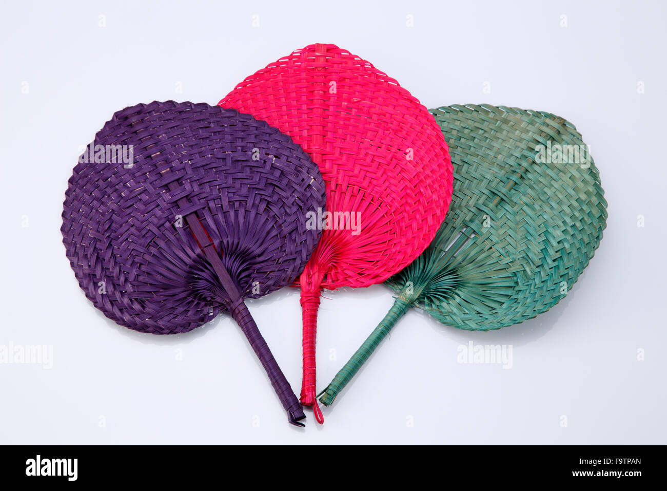 native fan made from palm leaves on white background Stock Photo - Alamy