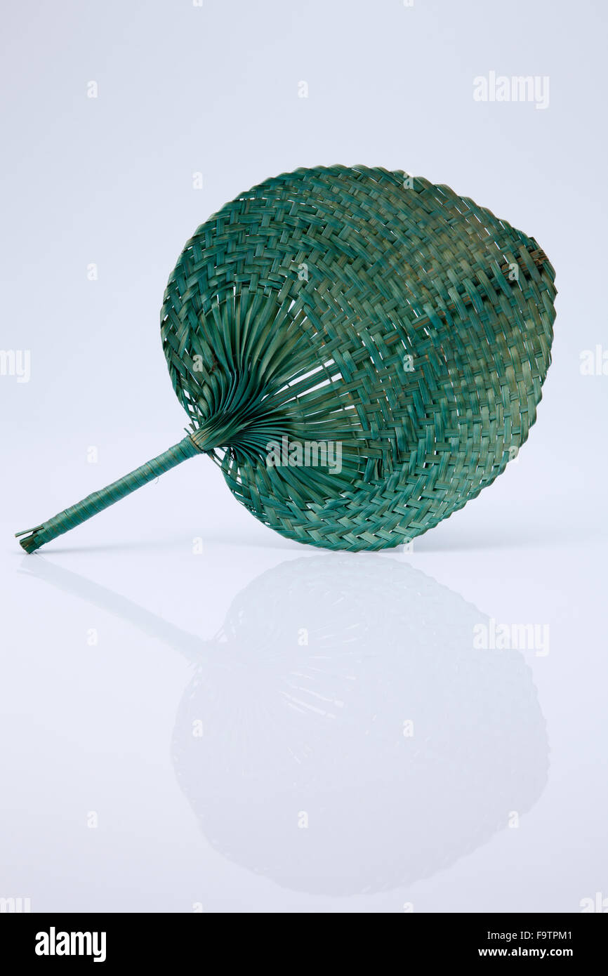 native fan made from palm leaves on white background Stock Photo - Alamy