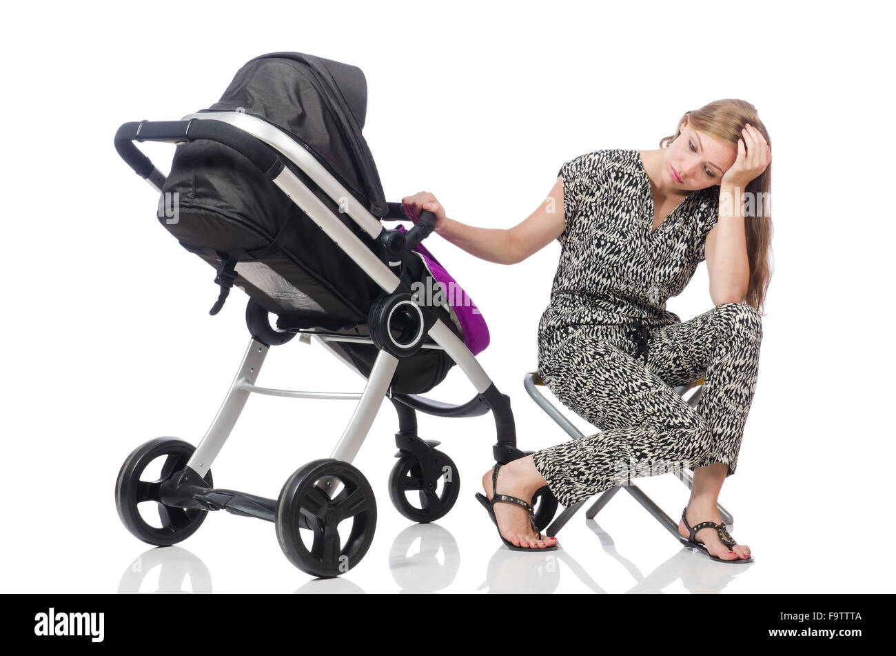 Happy mom with her baby in pram Stock Photo - Alamy