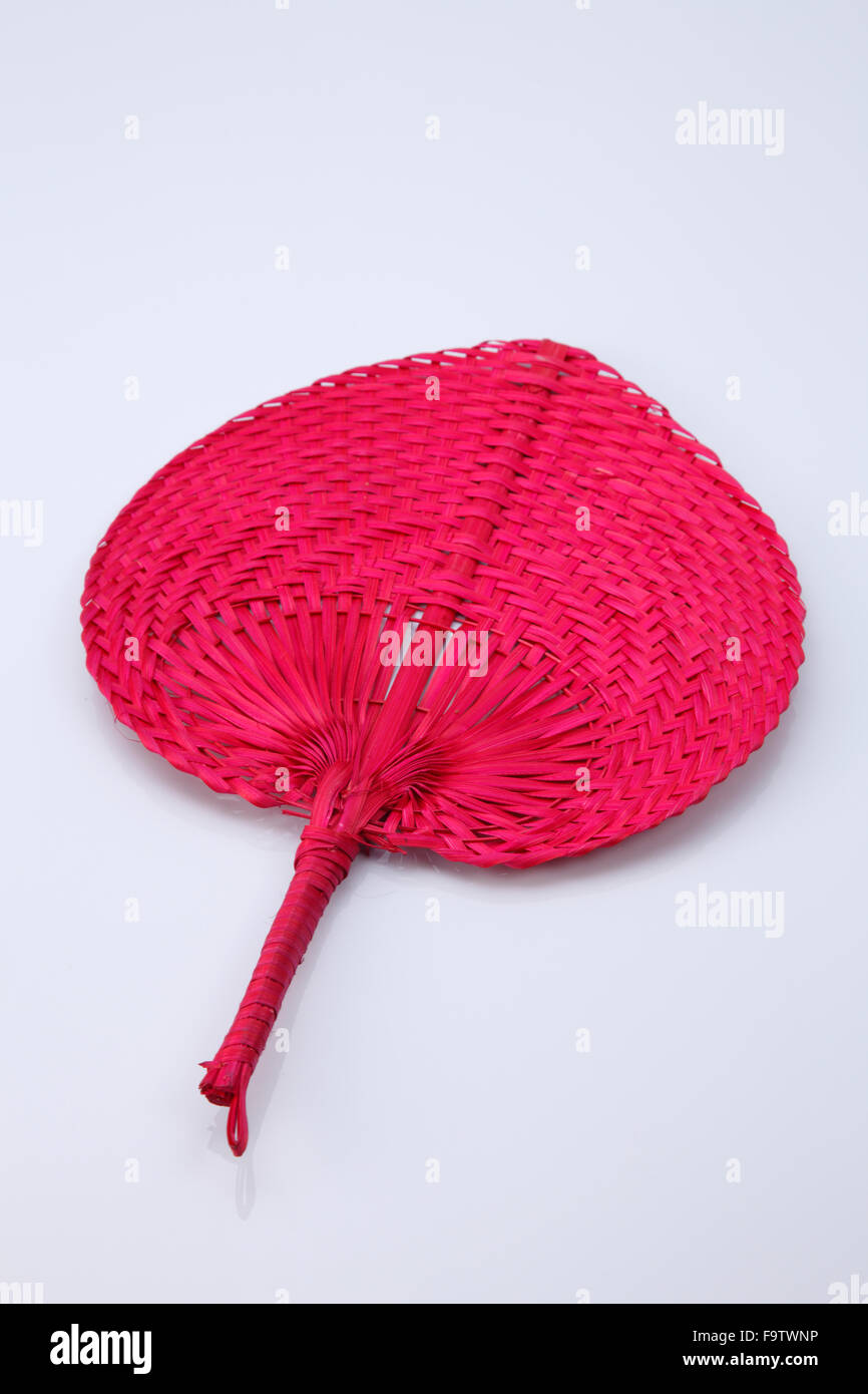 Red color native fan made from palm leaves on white background Stock ...