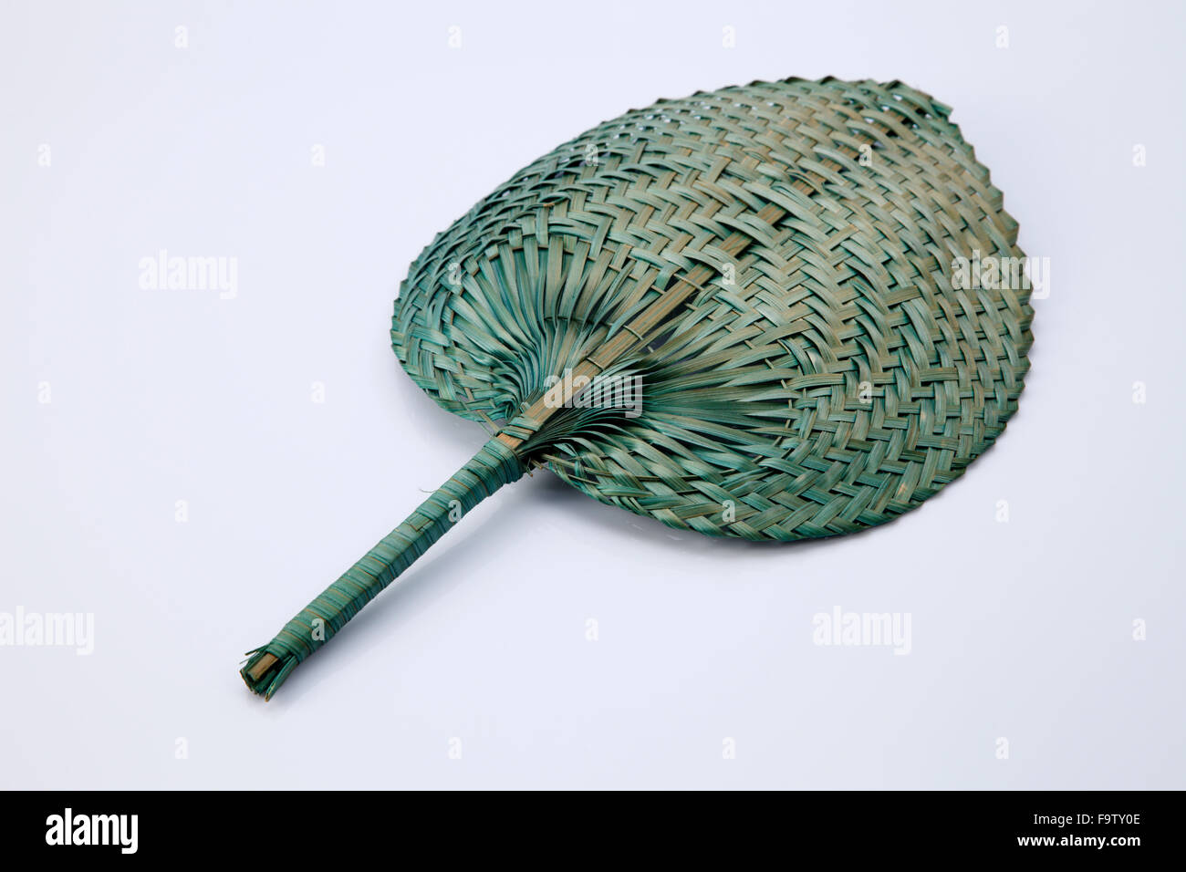Green color native fan made from palm leaves on white background Stock ...