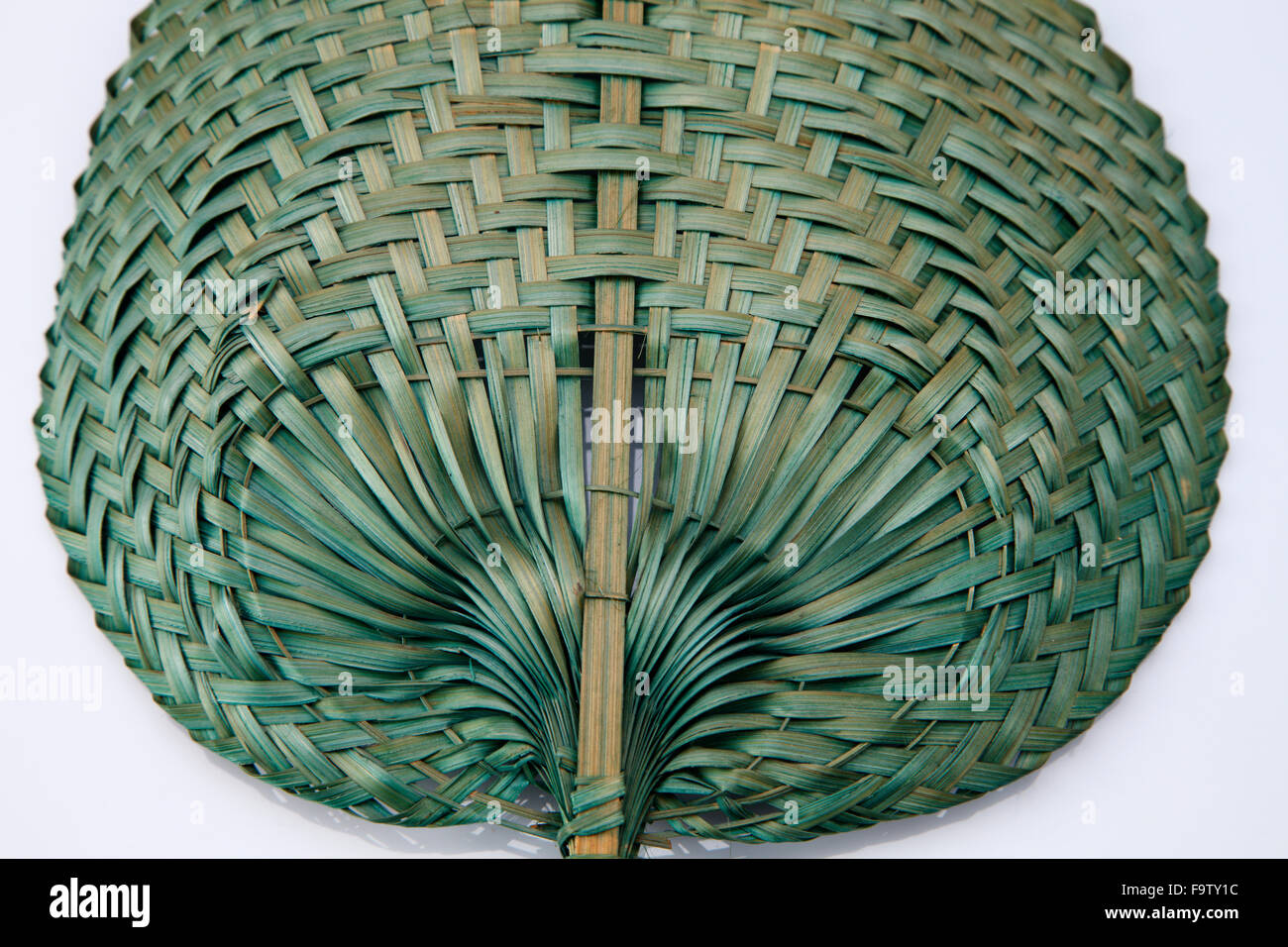 Green color native fan made from palm leaves on white background Stock ...