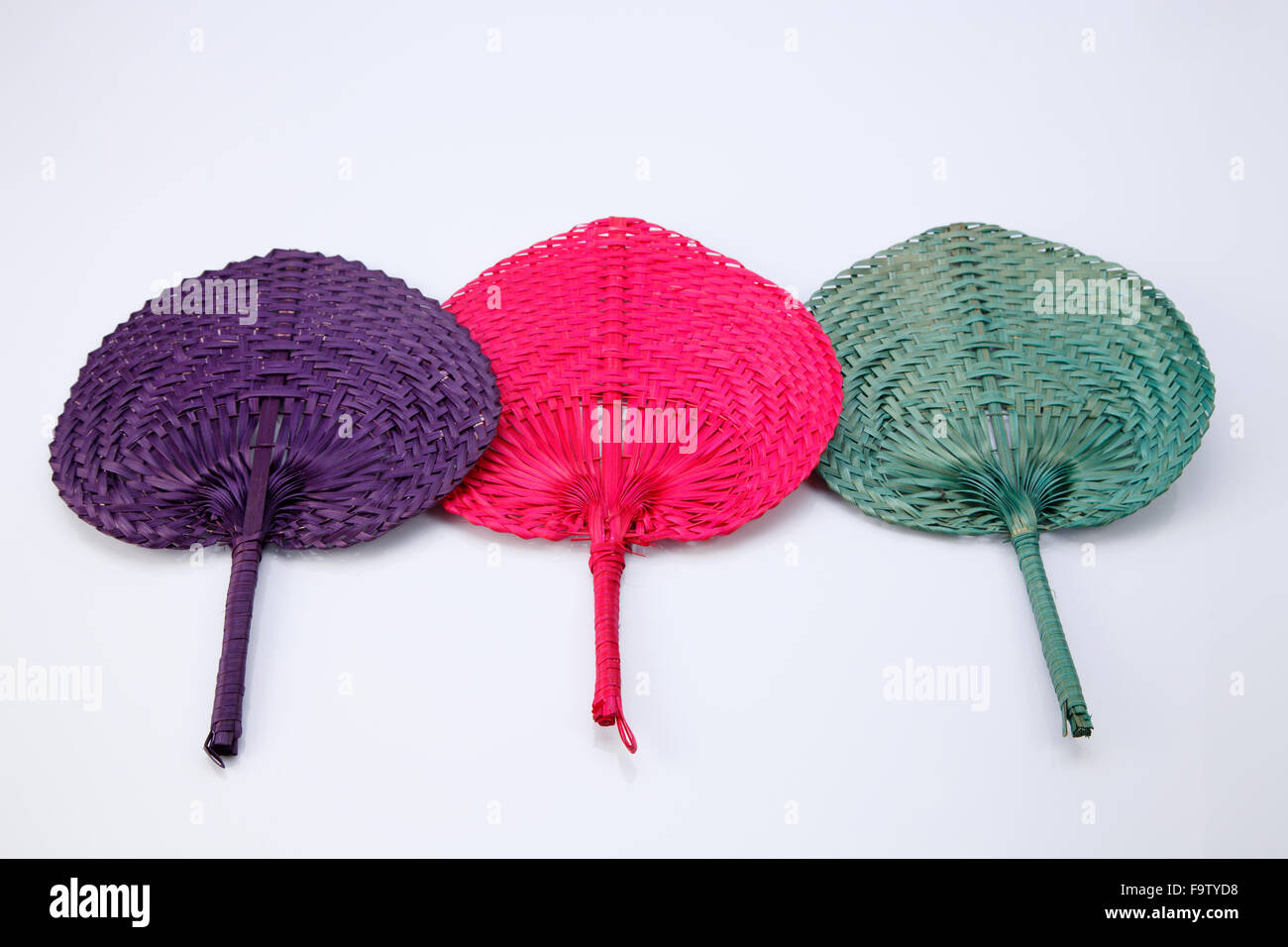 native fan made from palm leaves on white background Stock Photo - Alamy