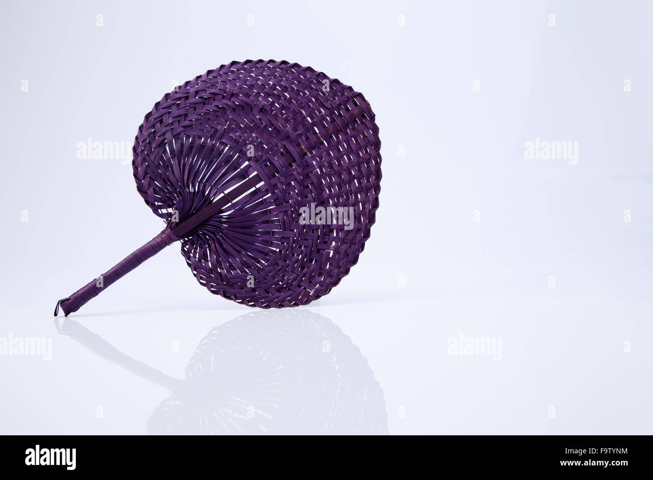 native fan made from palm leaves on white background Stock Photo - Alamy