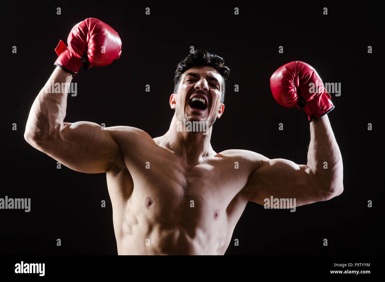 Muscular man in boxing concept Stock Photo - Alamy