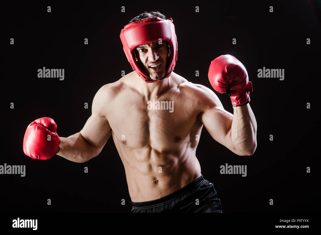 Muscular man in boxing concept Stock Photo - Alamy