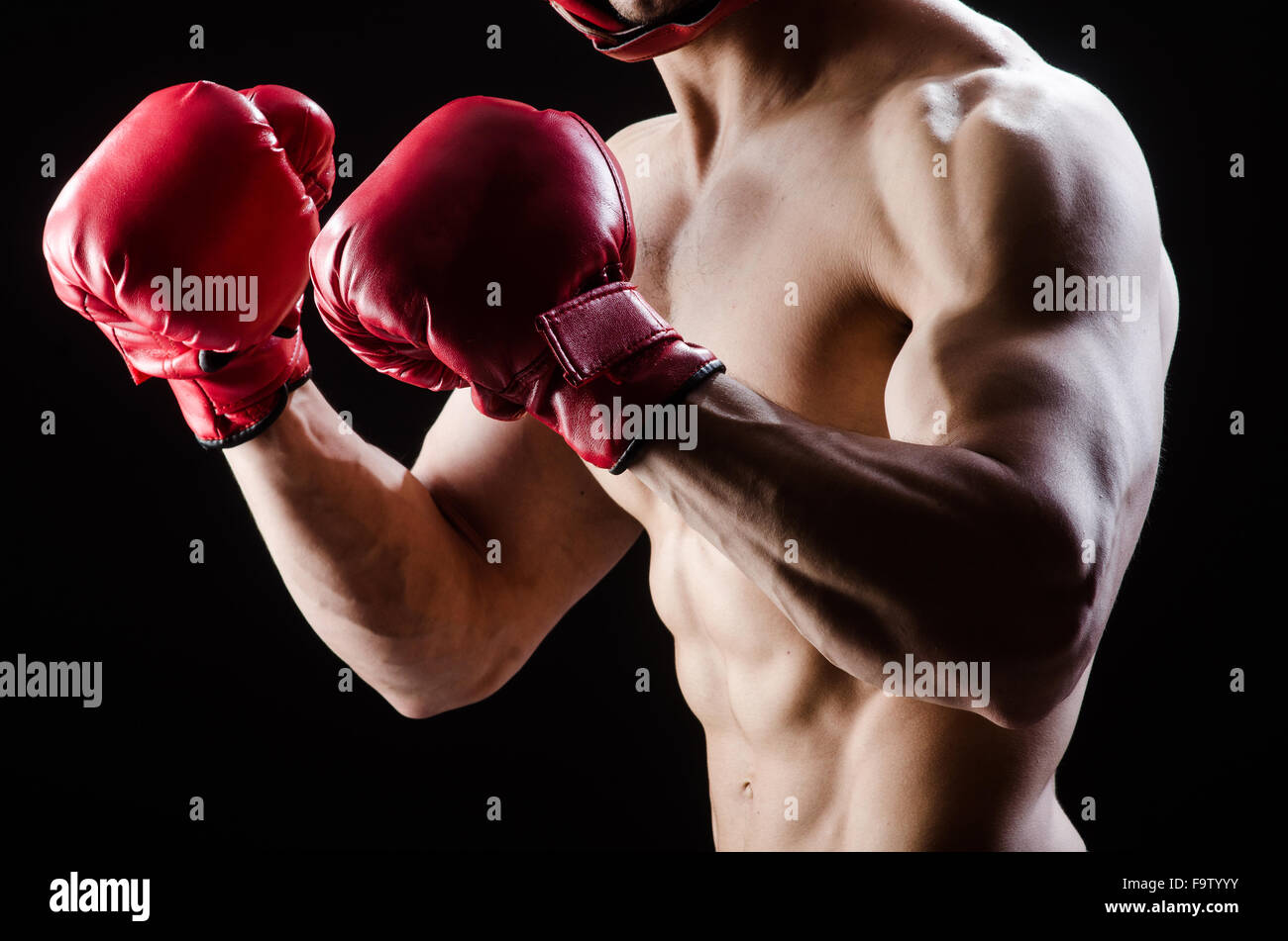 Muscular man in boxing concept Stock Photo - Alamy