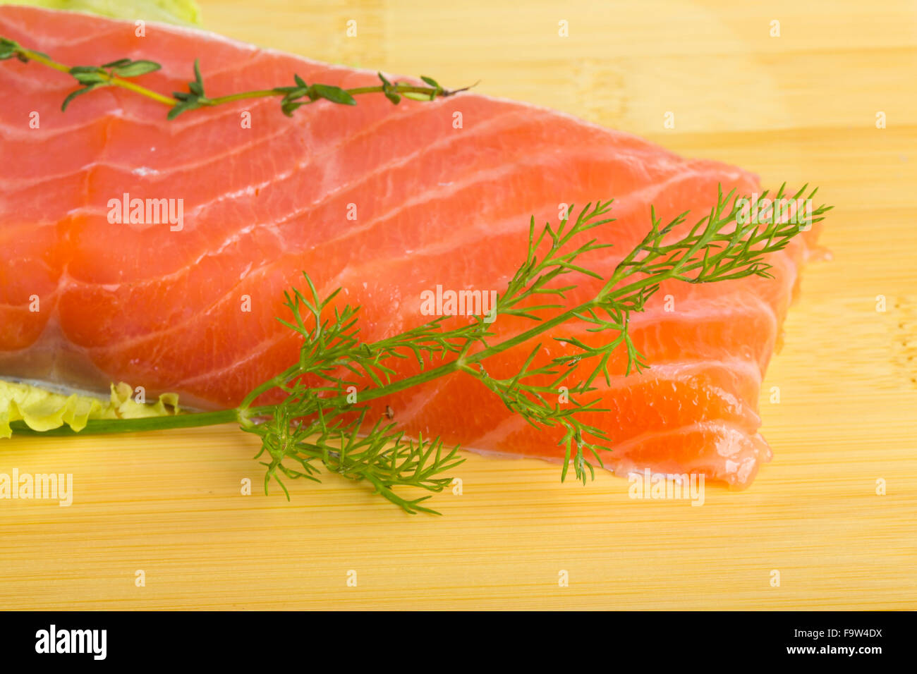 Salmon fillet garnished Stock Photo - Alamy