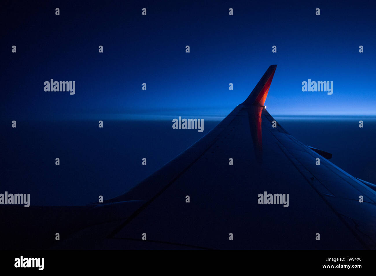 Plane Wing In Flight At Sunset Stock Photo - Alamy