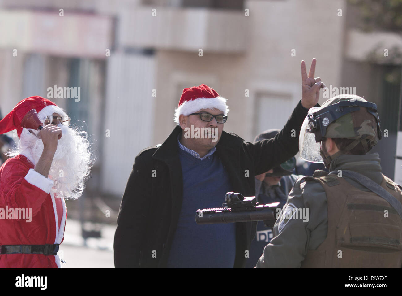 Bethlehem, West Bank. 18th Dec, 2015. Palestinian protestors in Santa's ...