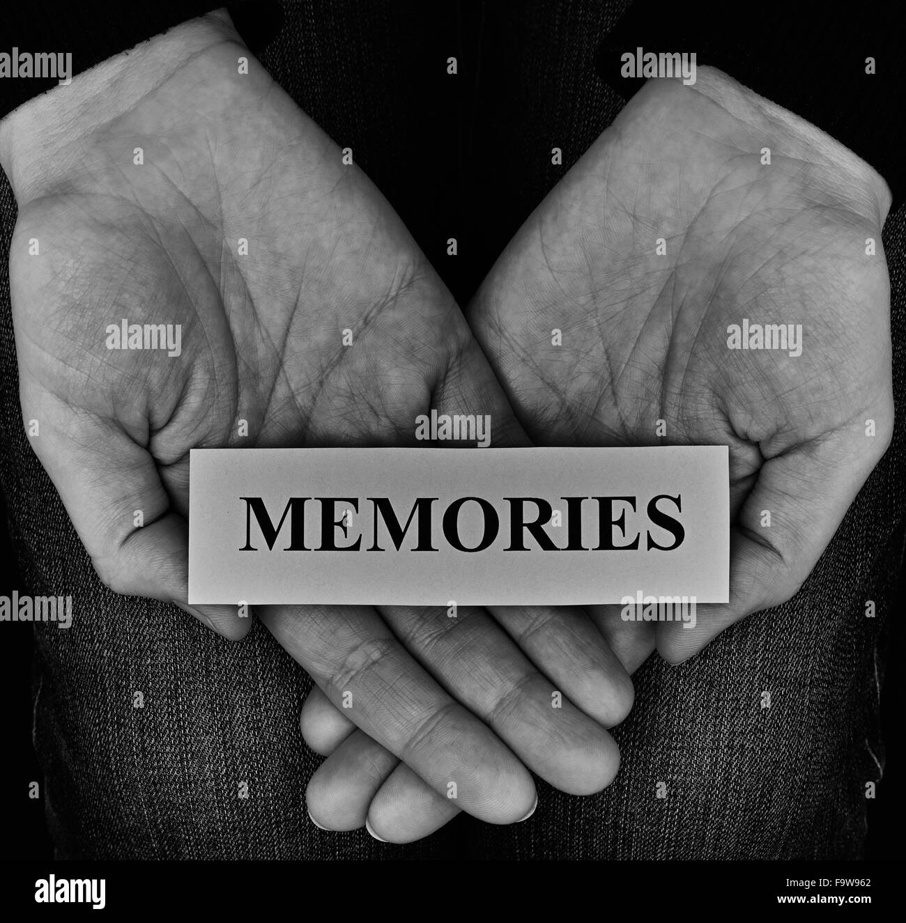 Woman holding word Memories in her palms. Black and White image. Close ...