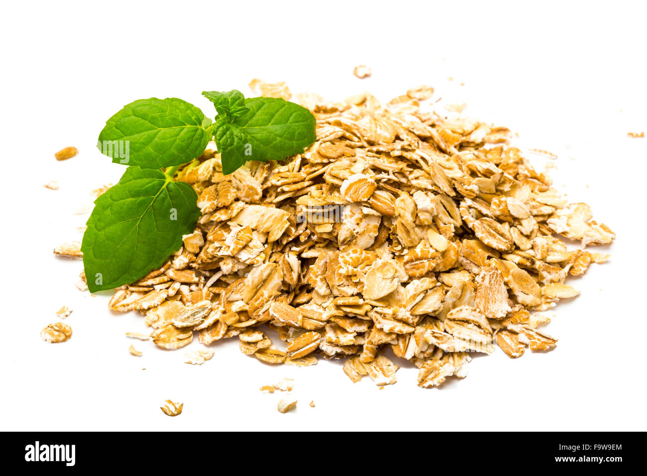 Oats pile with mint branch Stock Photo - Alamy