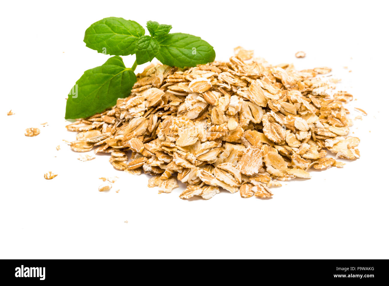 Oats pile with mint branch Stock Photo - Alamy