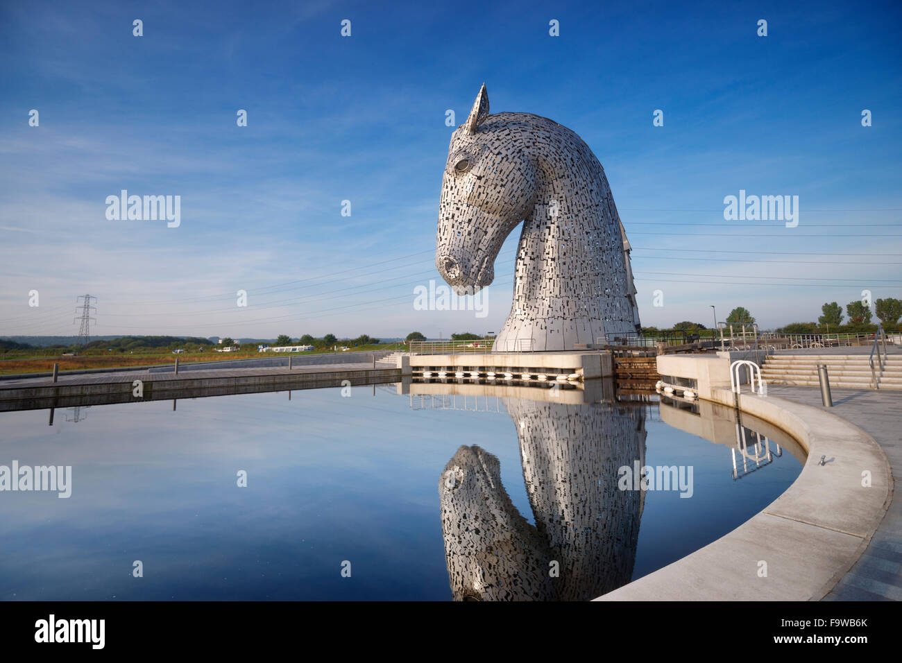 The Kelpies, Helix Park, Falkirk, Scotland, UK. Reflected in canal ...