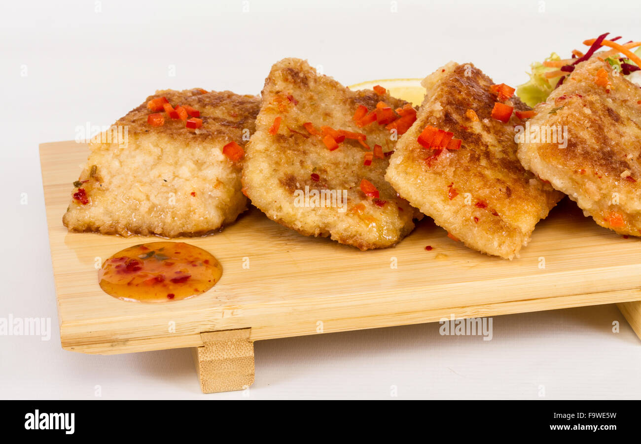 Fried fish fillets with salad Stock Photo - Alamy