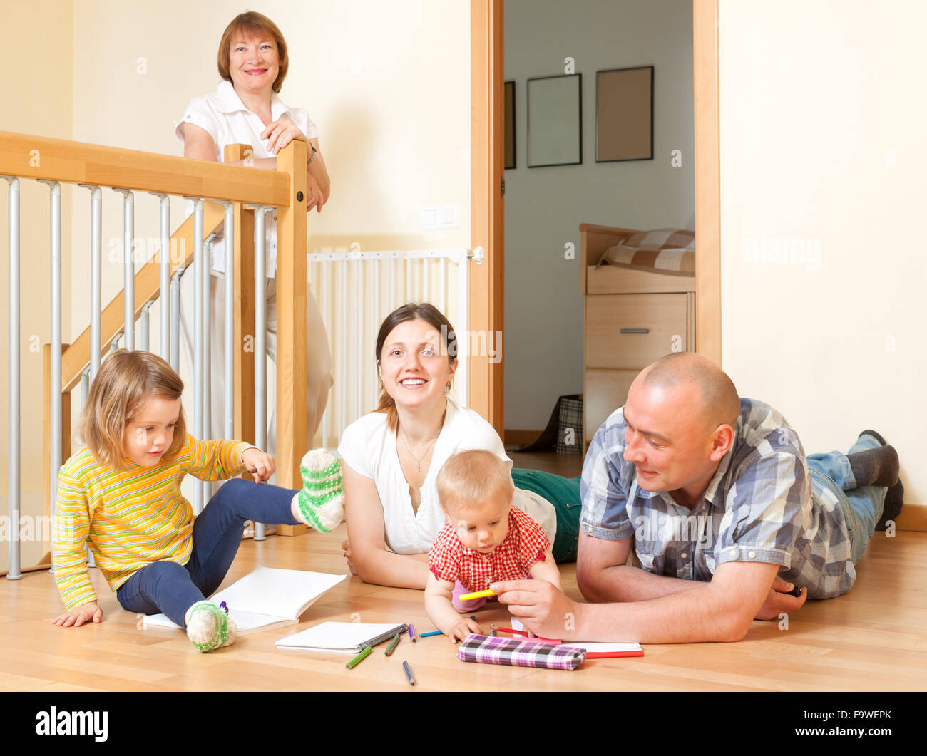 Portrait of smiling happy three generations family with two little ...