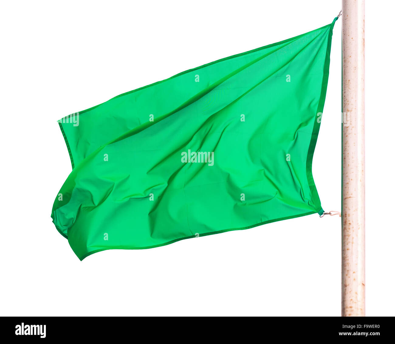 Green flag over white background Stock Photo - Alamy