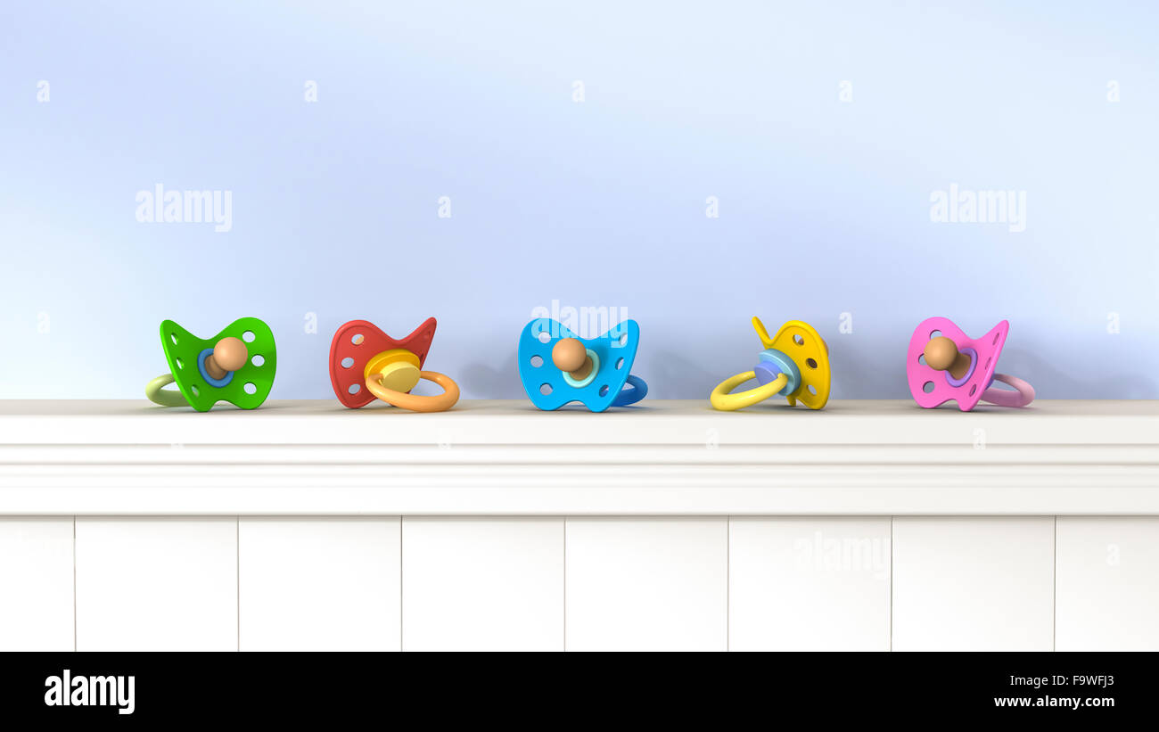 Row of different pacifiers on a shelf hi-res stock photography and ...