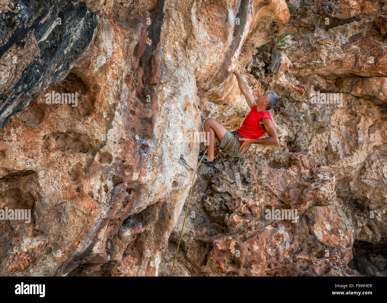 Malta, Ghar Lapsi, McCarthey's Cave, rock climber Stock Photo - Alamy