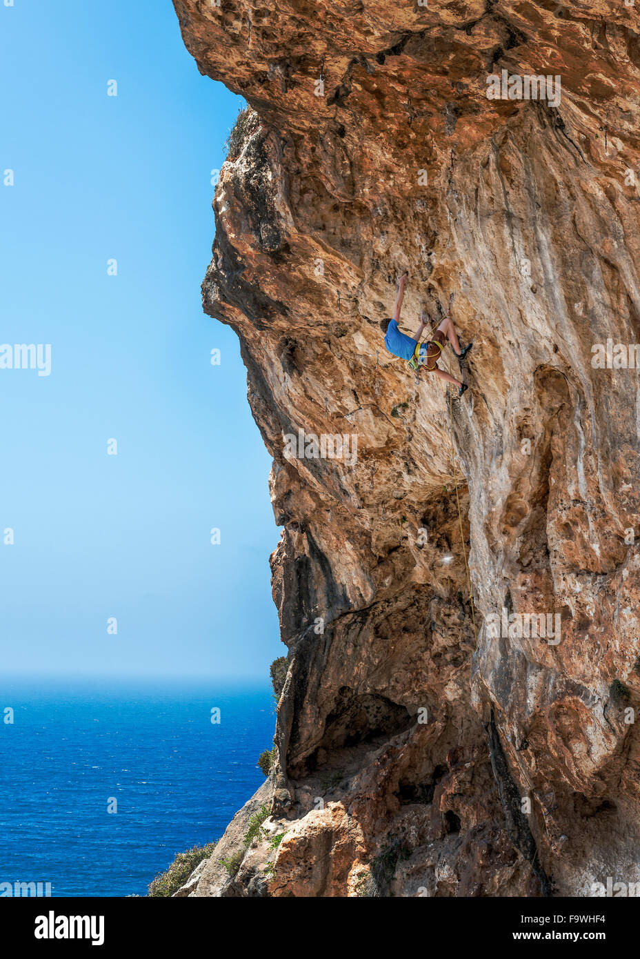 Malta, Ghar Lapsi, McCarthey's Cave, rock climber Stock Photo - Alamy