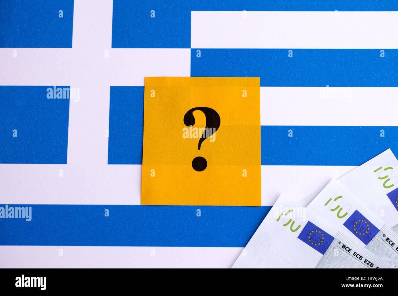 Flag of Greece with question mark and one hundred euro banknotes ...