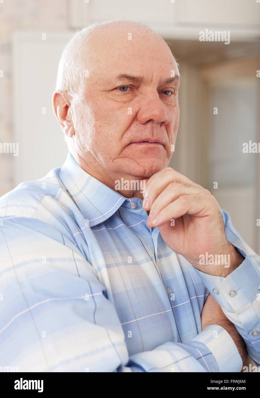 portrait of wistful grizzled man in interior Stock Photo - Alamy