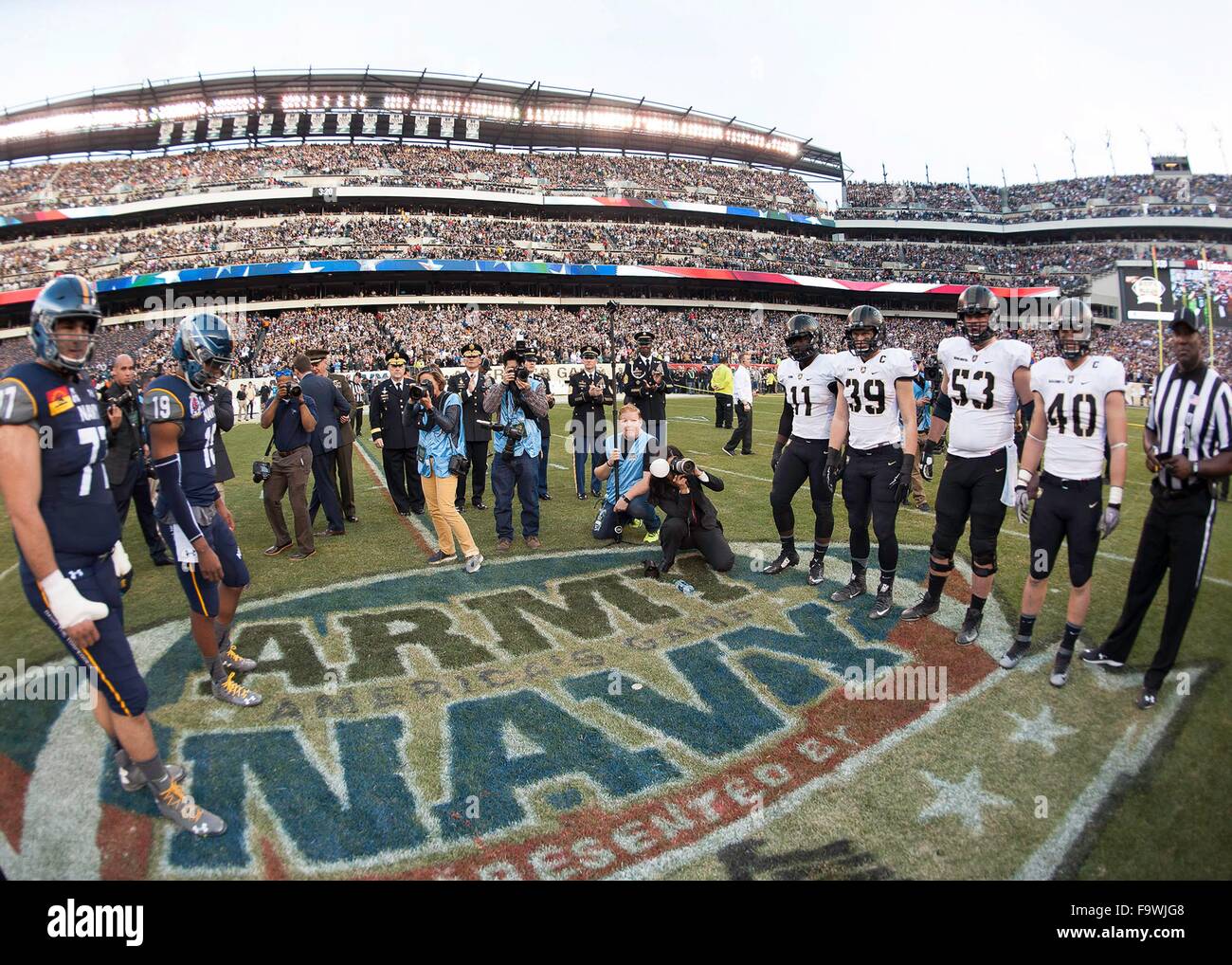 West Point Army Black Knights and U.S. Naval Academy Midshipmen gather for the coin toss at ...