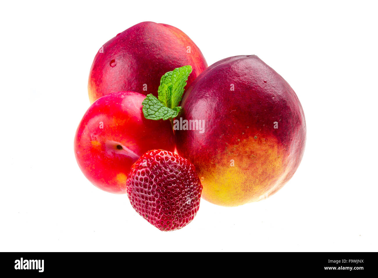 Ripe bright peaches, plum, strawberry and mint Stock Photo - Alamy
