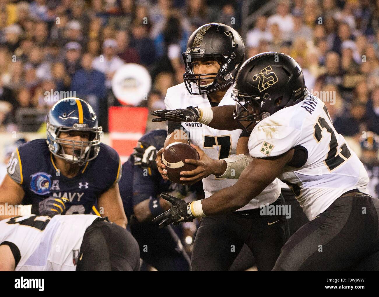 Army Black Knights quarterback Chris Carter (7) hands the ball off to ...