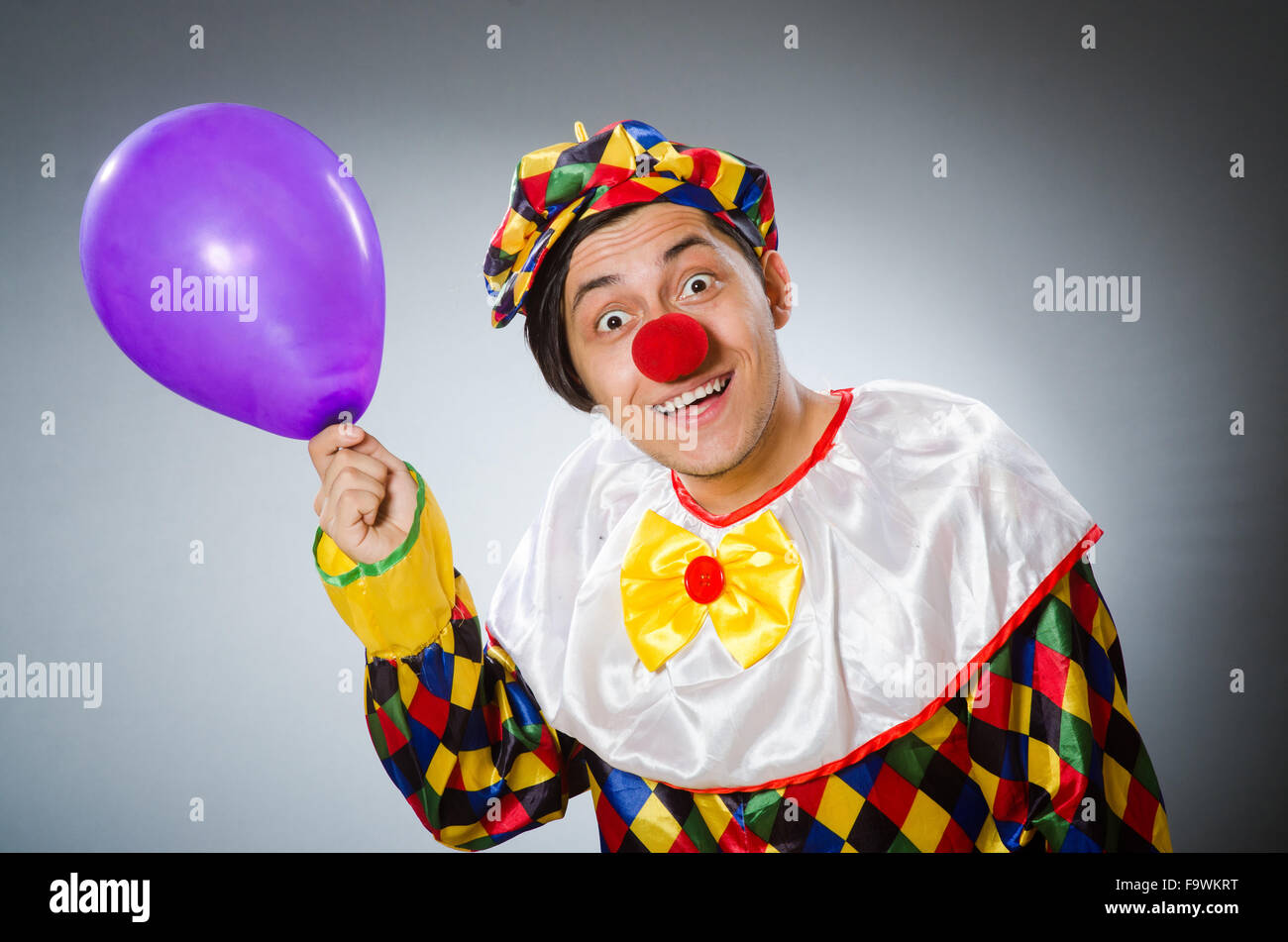 Funny clown in comical concept Stock Photo - Alamy