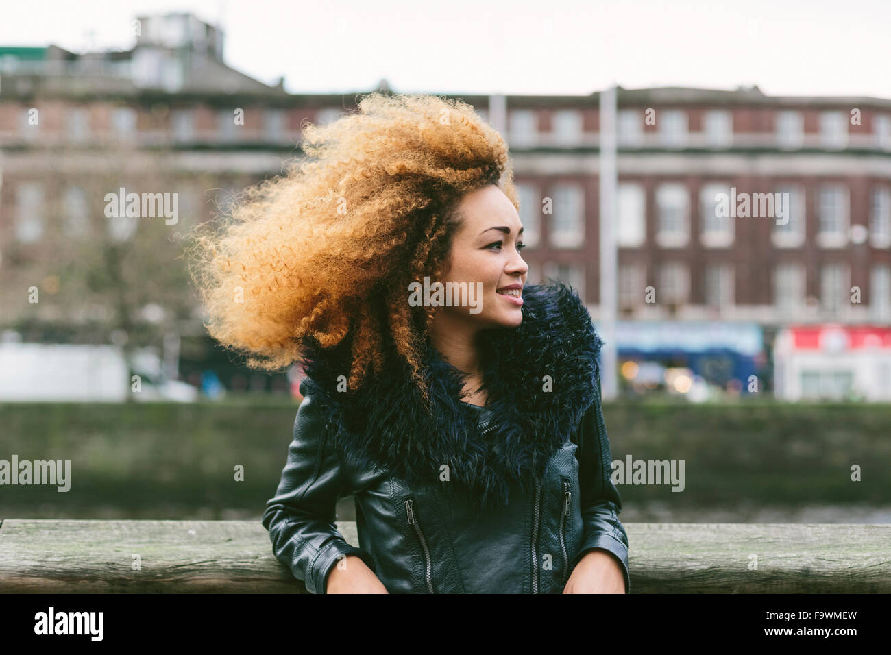 Ireland, Dublin, smiling woman with afro Stock Photo - Alamy