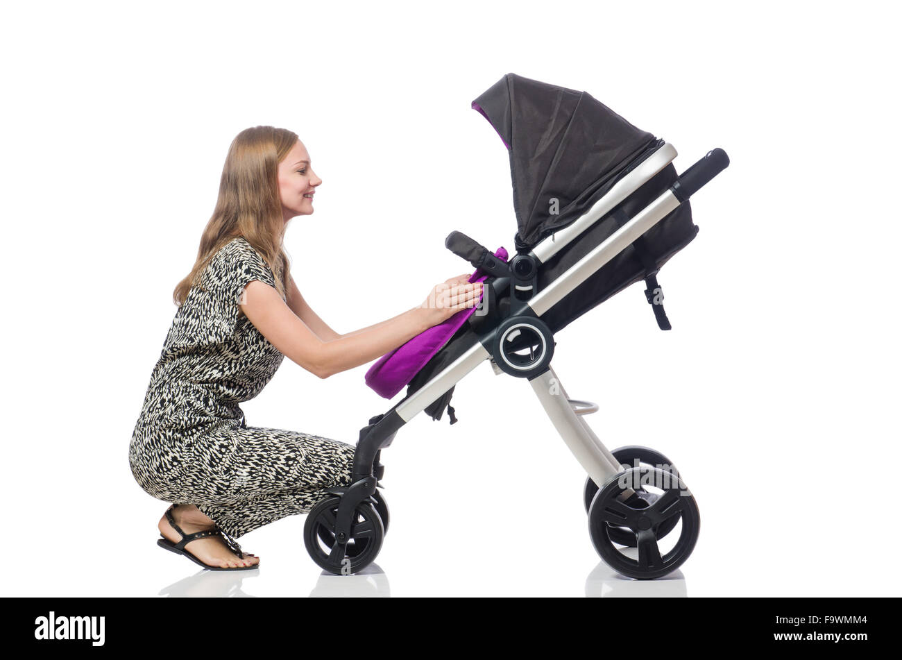 Happy mom with her baby in pram Stock Photo - Alamy