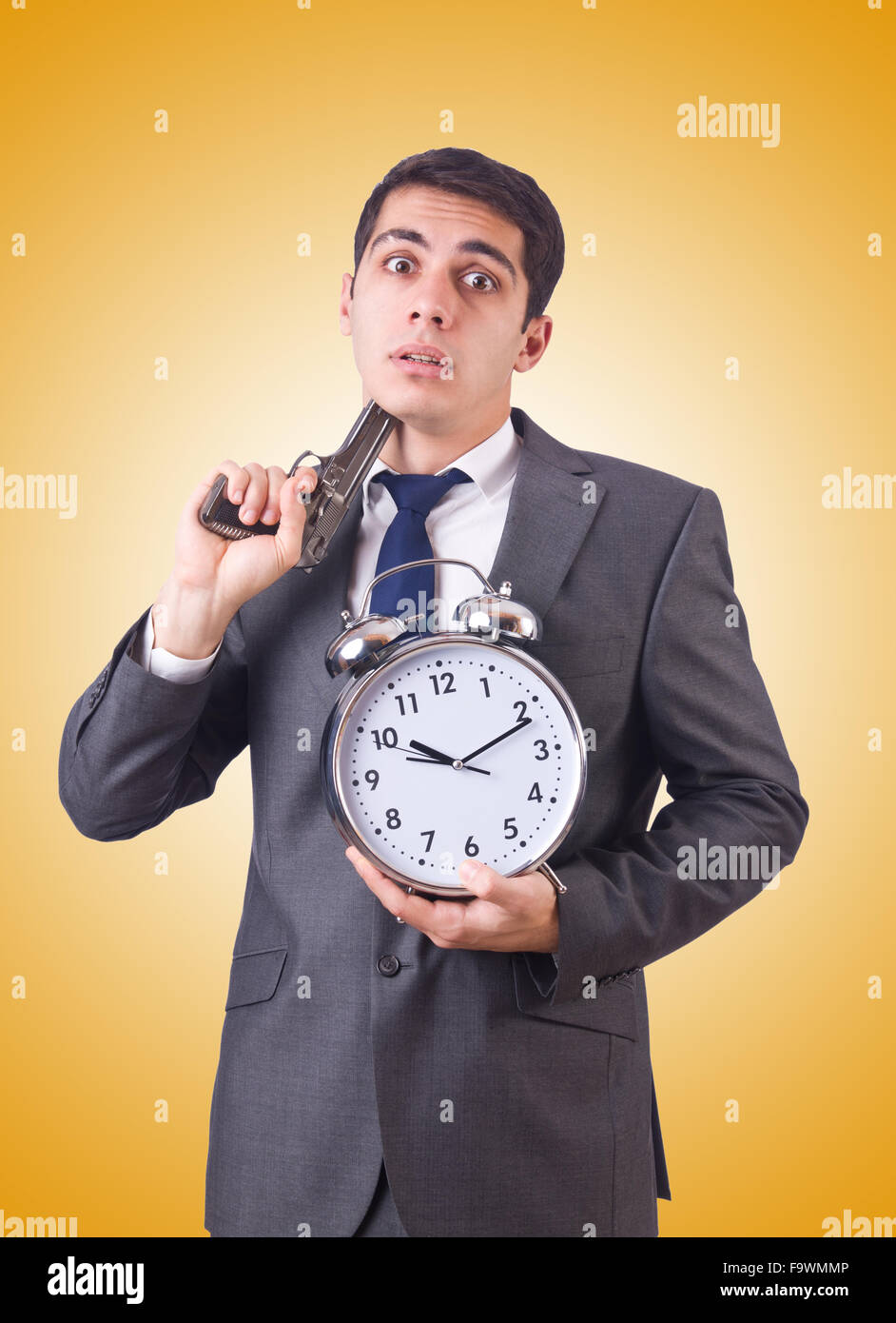 Man with gun and clock on white Stock Photo - Alamy