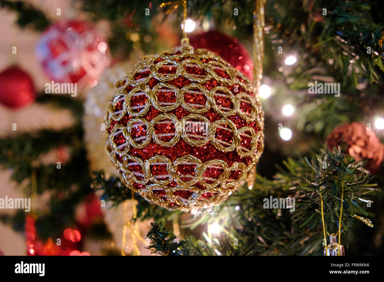 Ornamented bauble decorates a Christmas tree Stock Photo - Alamy