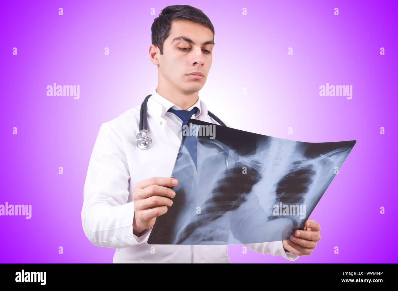 Young doctor with x-ray image on white Stock Photo - Alamy