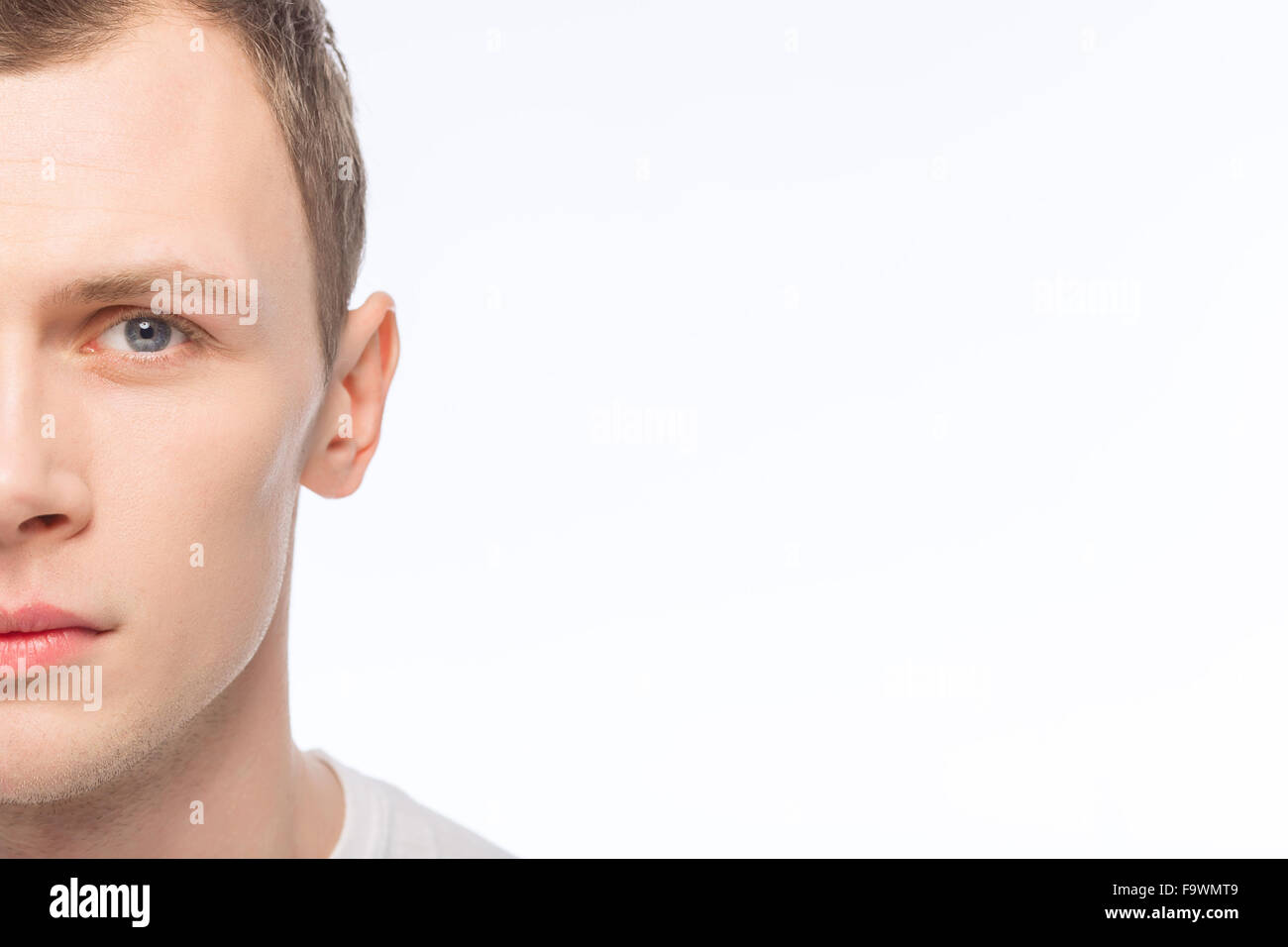 Handsome man looking serious Stock Photo - Alamy