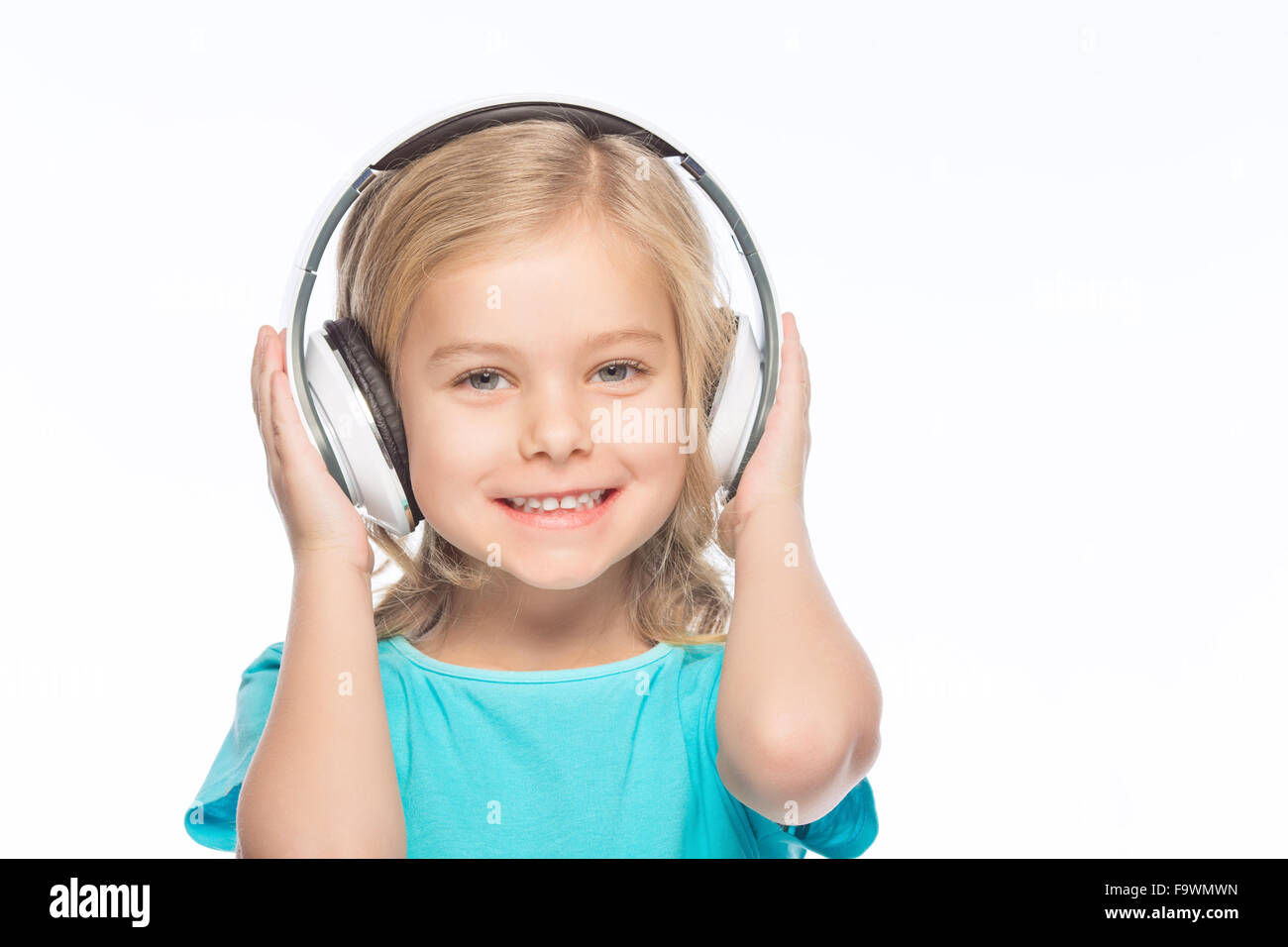 Little girl wearing headphones Stock Photo - Alamy