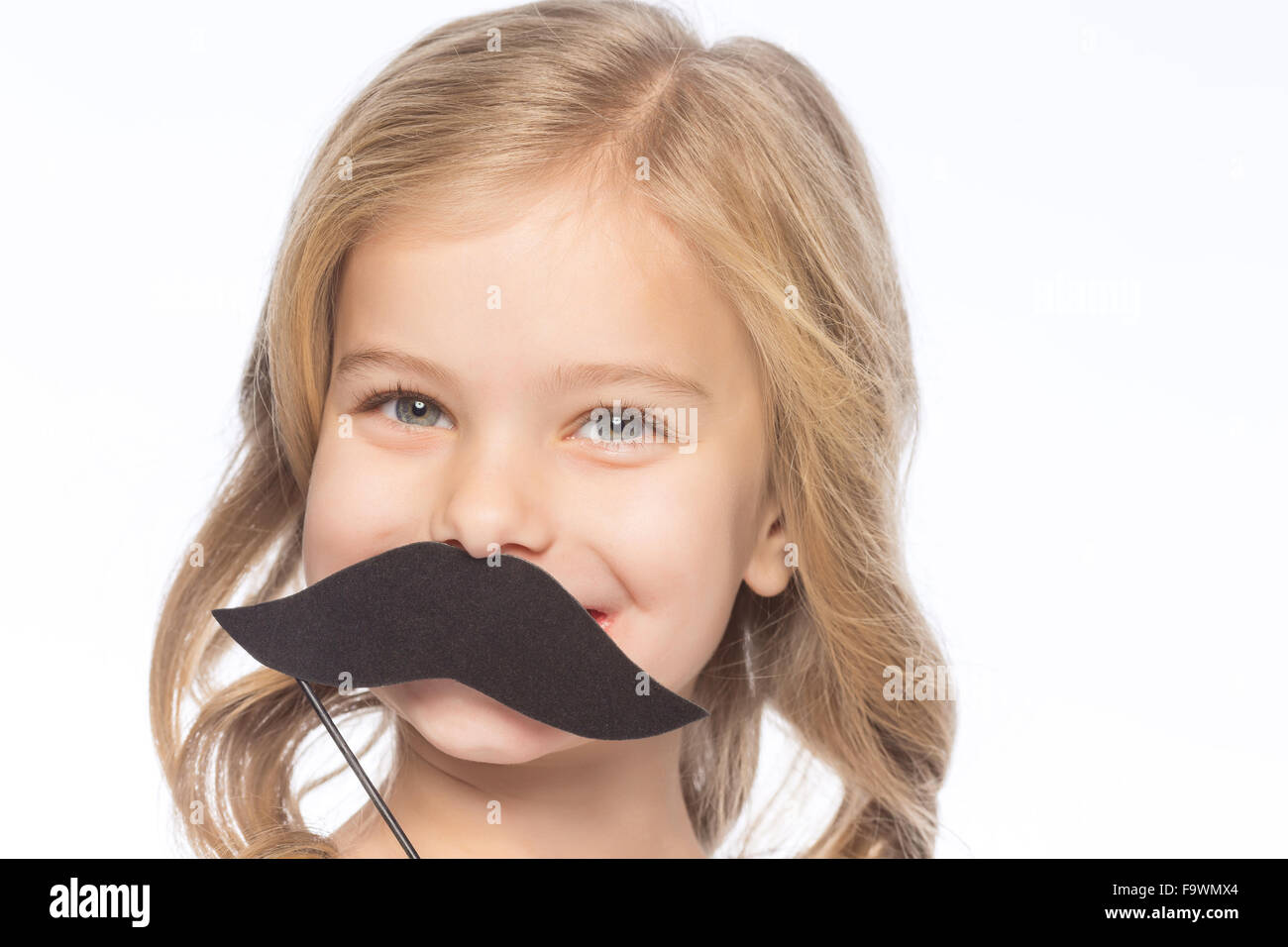 Little girl with decorative moustache Stock Photo - Alamy