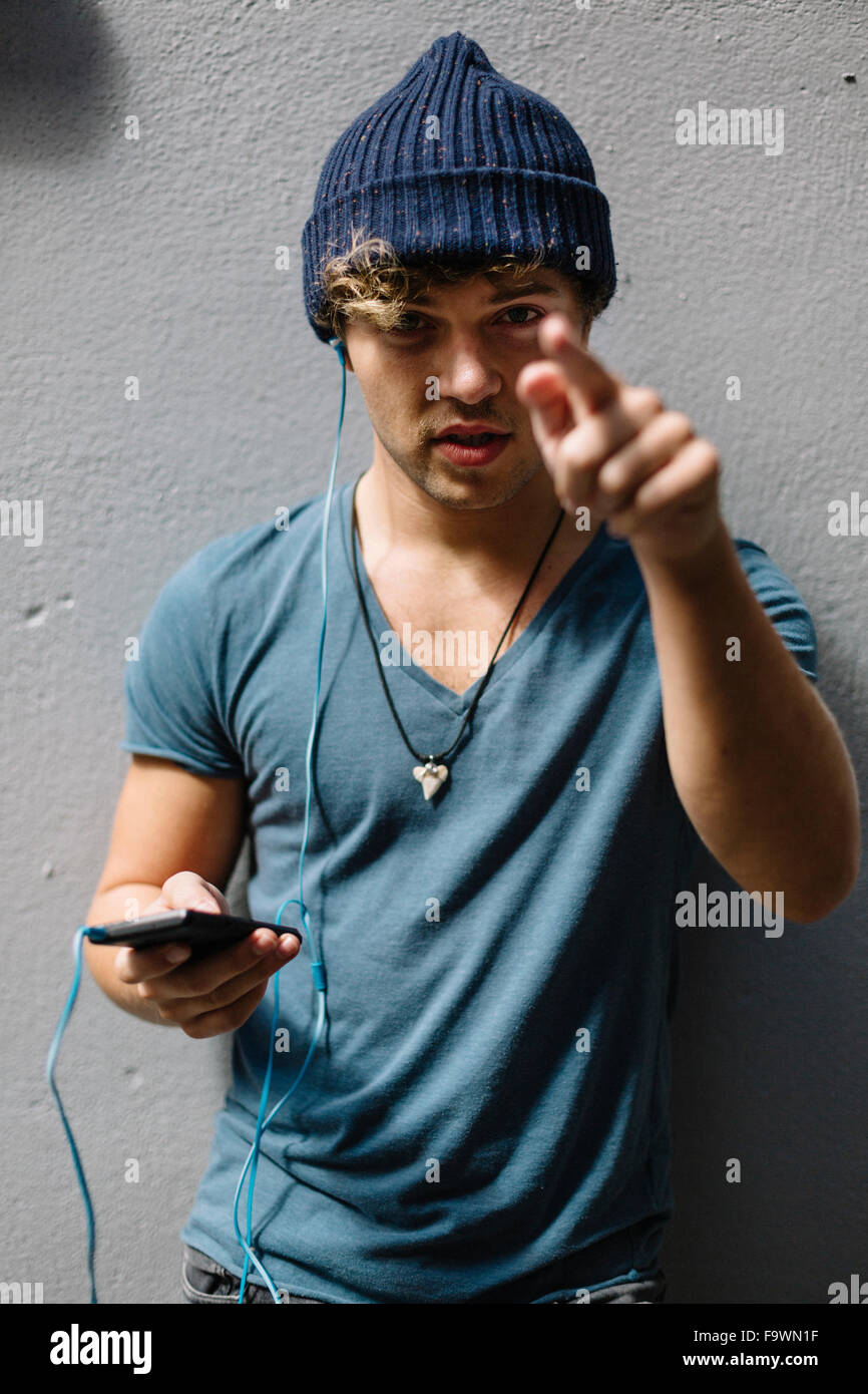 Young man pointing viewer hi-res stock photography and images - Alamy