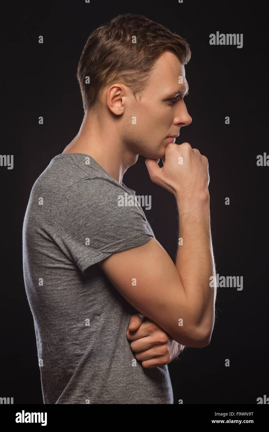 Young man deep in his thoughts Stock Photo - Alamy