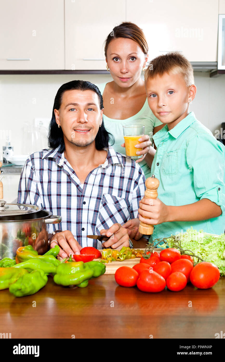 parents and teenager cooking together at home kitchen Stock Photo - Alamy