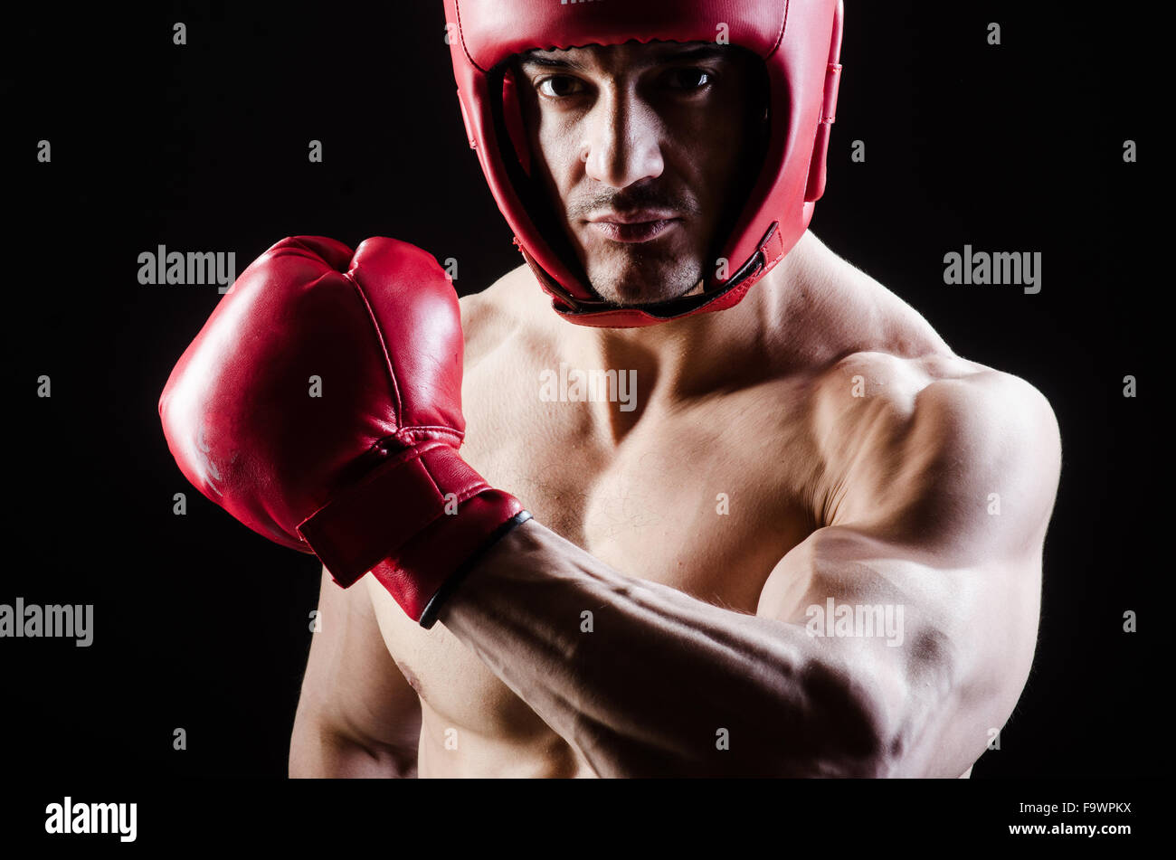 Muscular man in boxing concept Stock Photo - Alamy