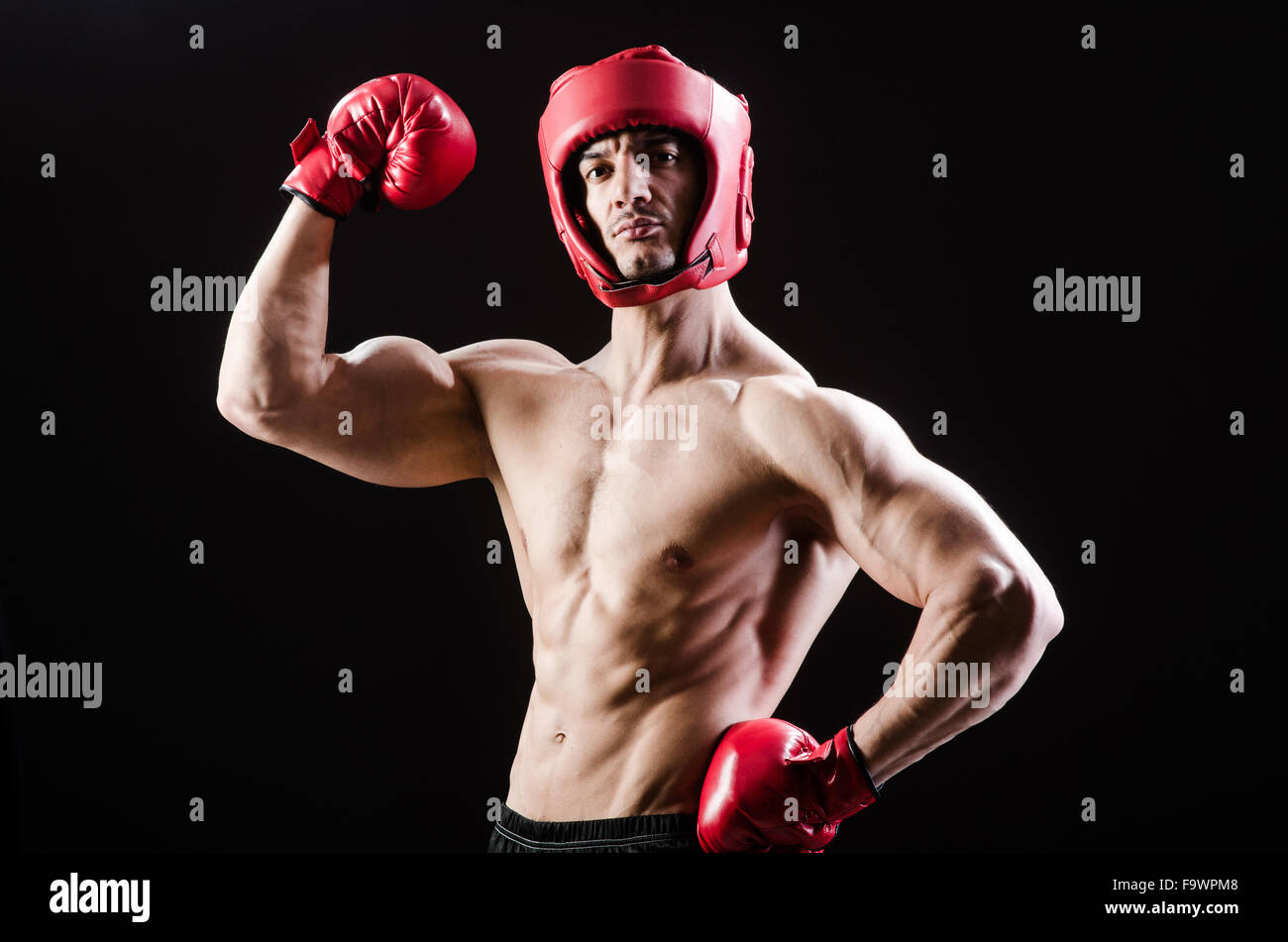Muscular man in boxing concept Stock Photo - Alamy