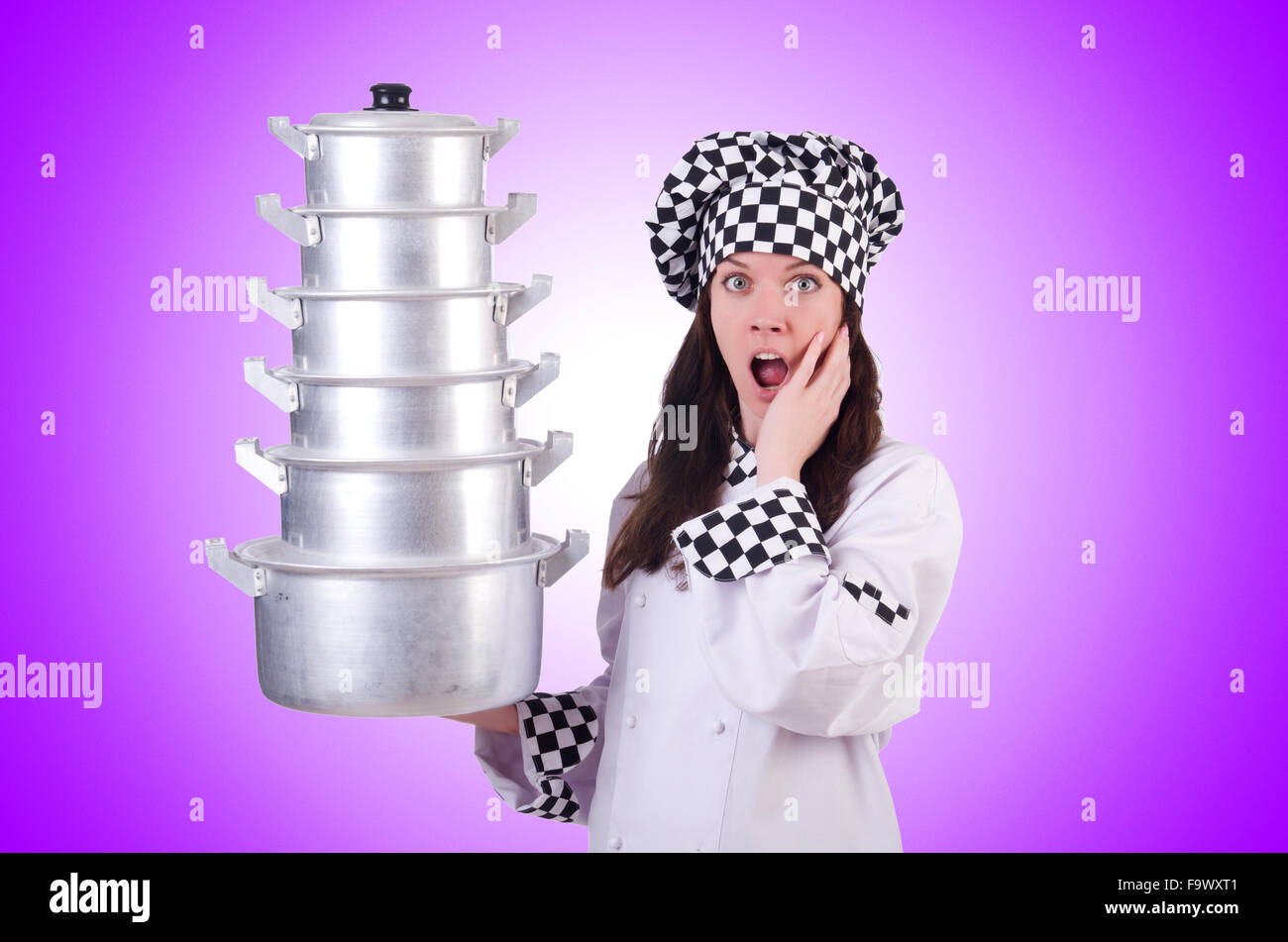 Cook with stack of pots on white Stock Photo - Alamy
