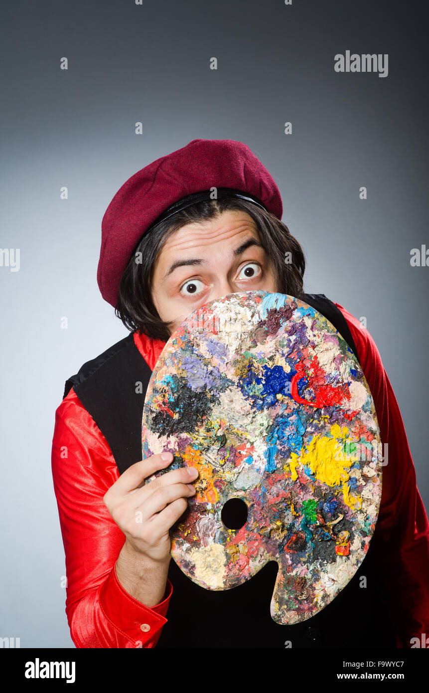 Funny artist in dark studio Stock Photo - Alamy