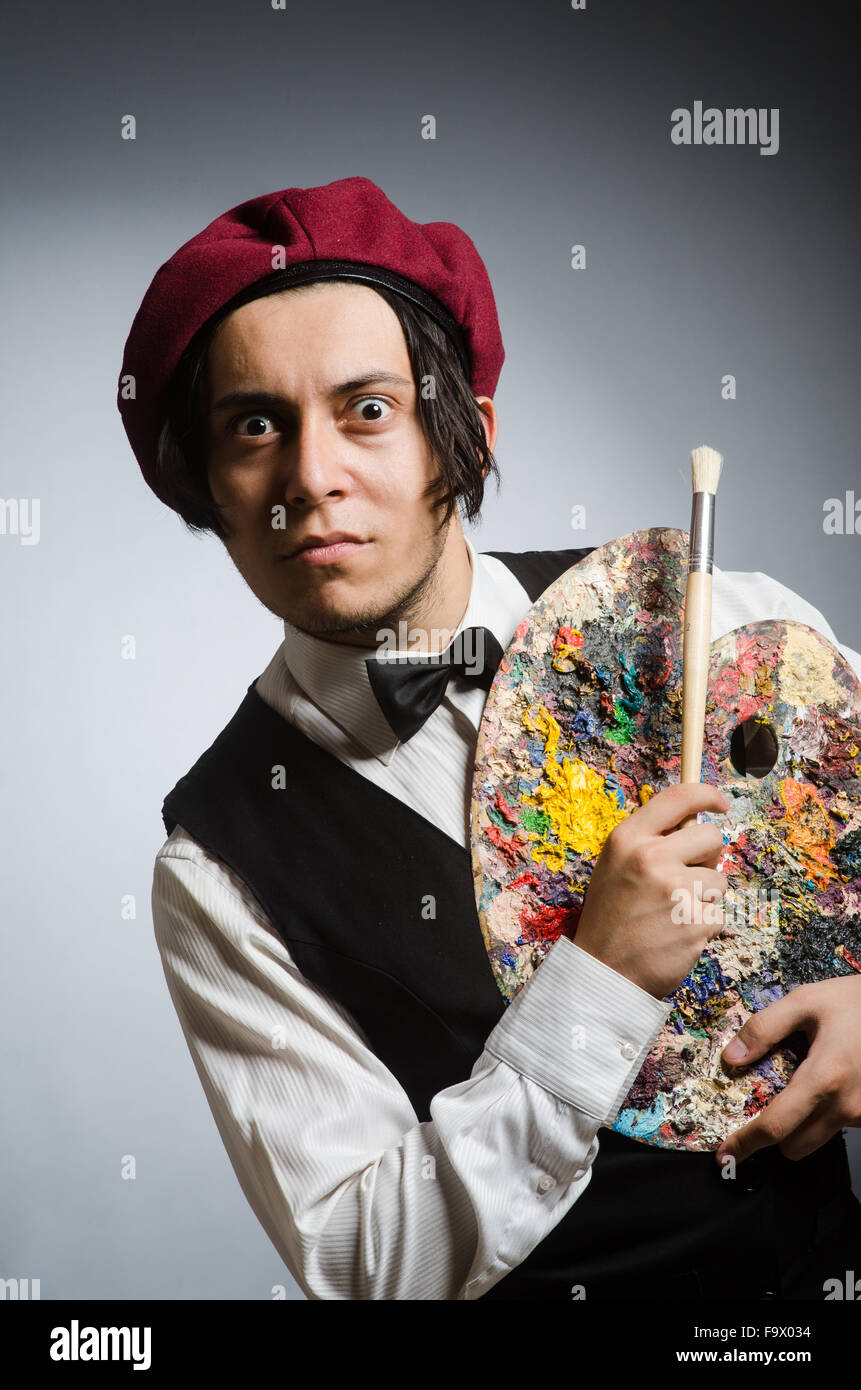 Funny artist in dark studio Stock Photo - Alamy